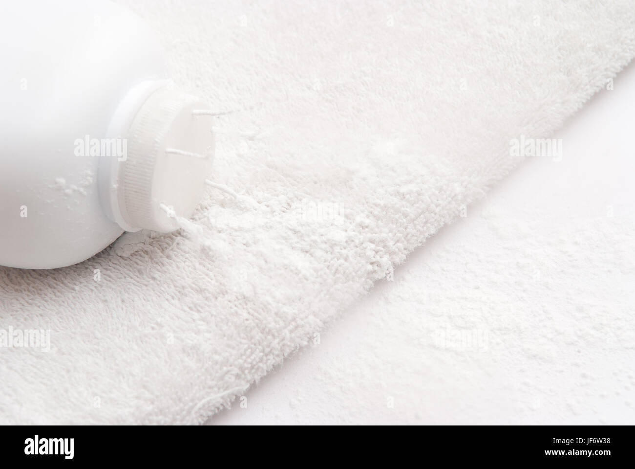 talcum powder on a soft white towel background Stock Photo - Alamy