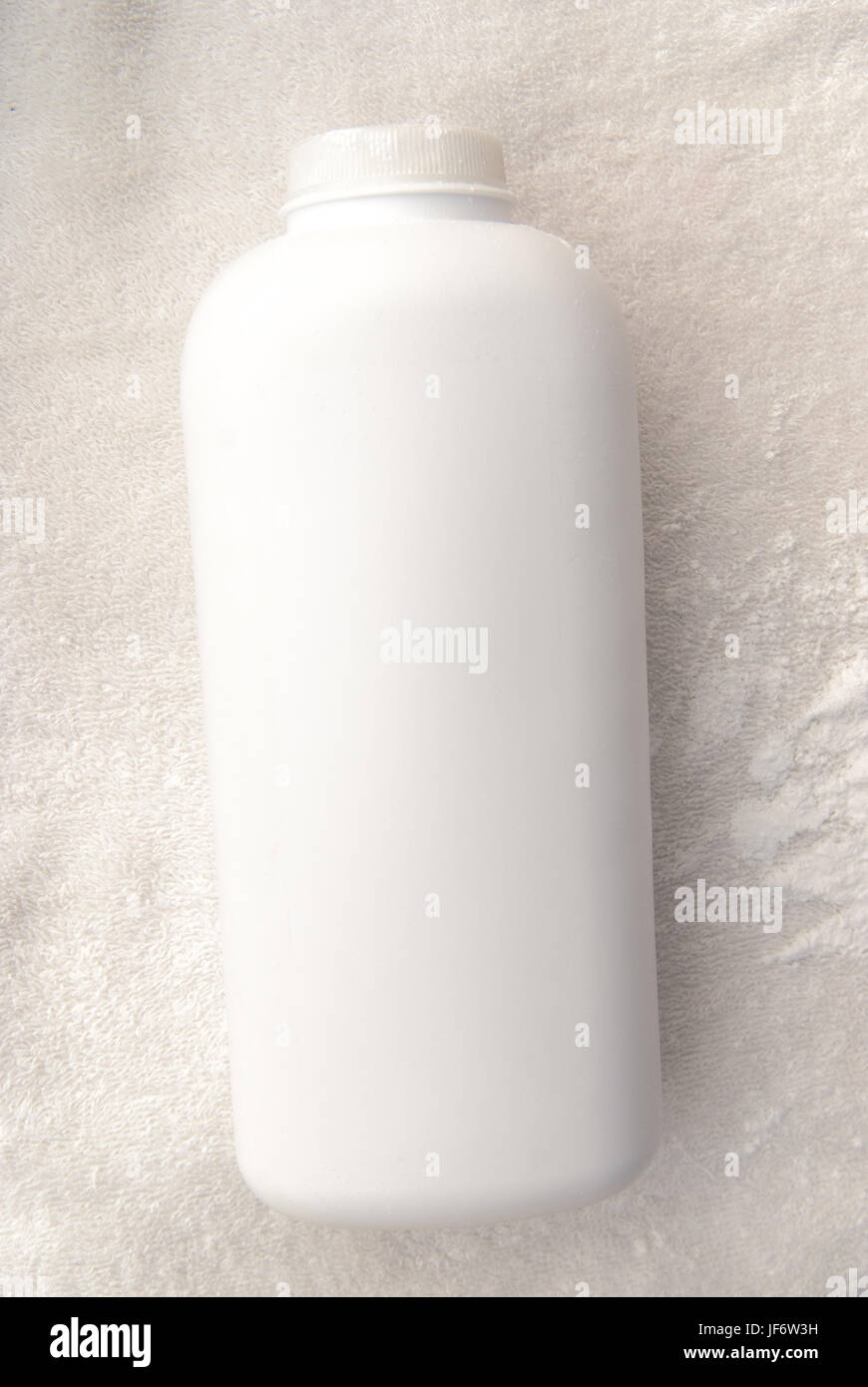talcum powder on a soft white towel background Stock Photo - Alamy