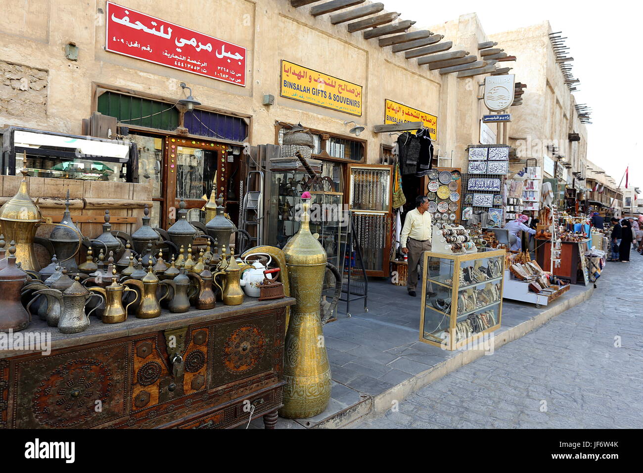 DOHA, QATAR - APRIL 9, 2017: Tourist shops in the main street of Souq ...