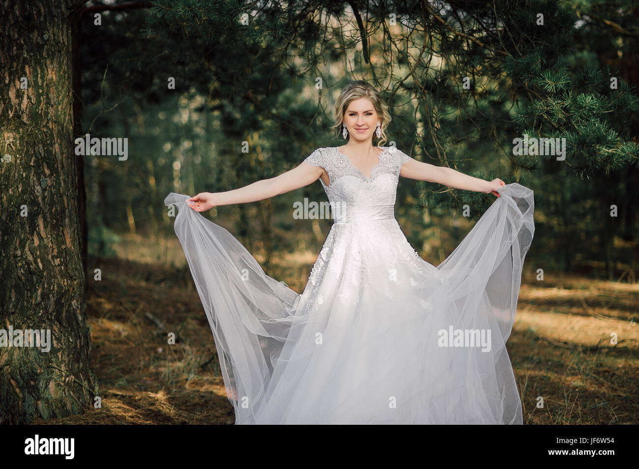 Beautiful bride woman portrait with bridal bouquet posing in her ...