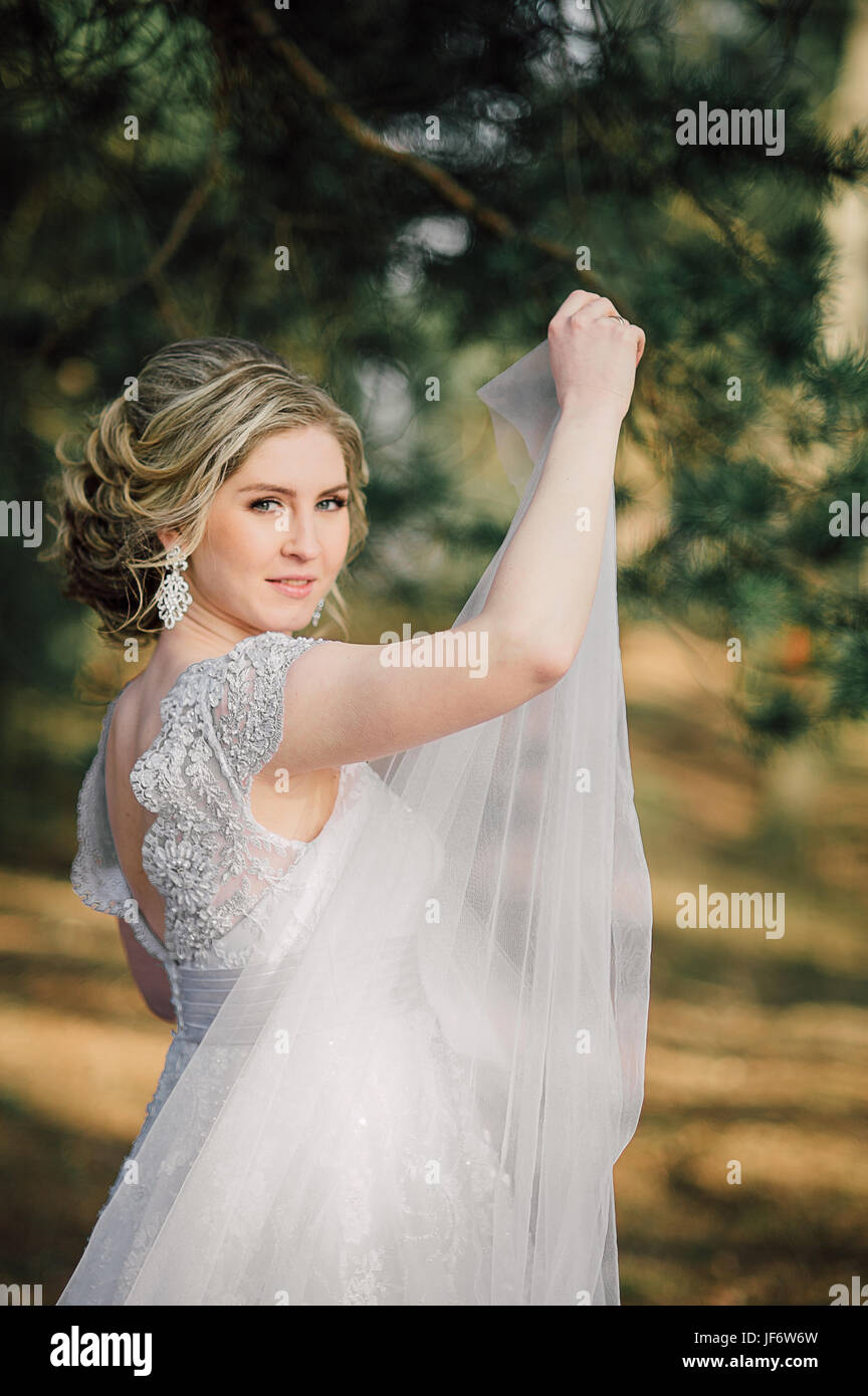 Beautiful bride woman portrait with bridal bouquet posing in her ...