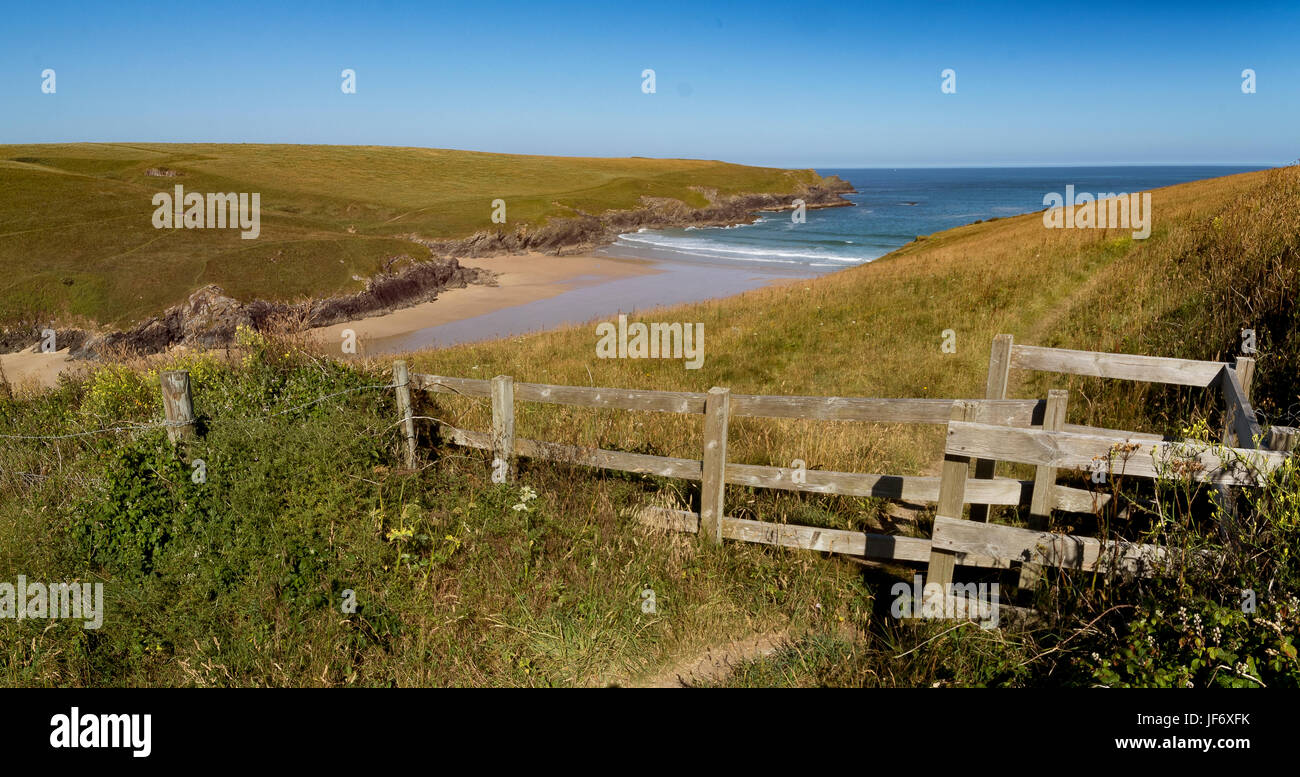 The footpath above Polly Joke cove and the view across the sandy beach ...