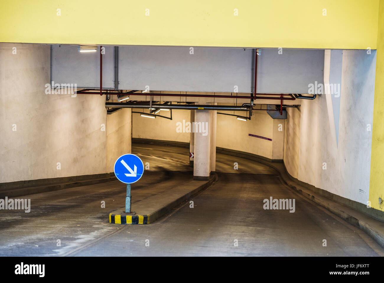 Entrance of an underground parking for cars with a mandatory traffic ...