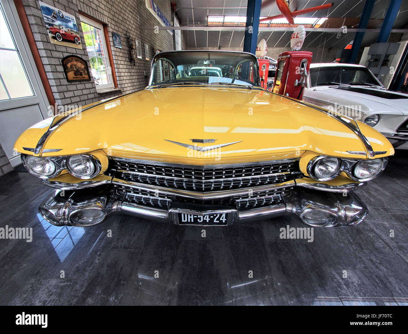 A rare yellow Cadillac showcased at Piet Smits' collection. The classic ...