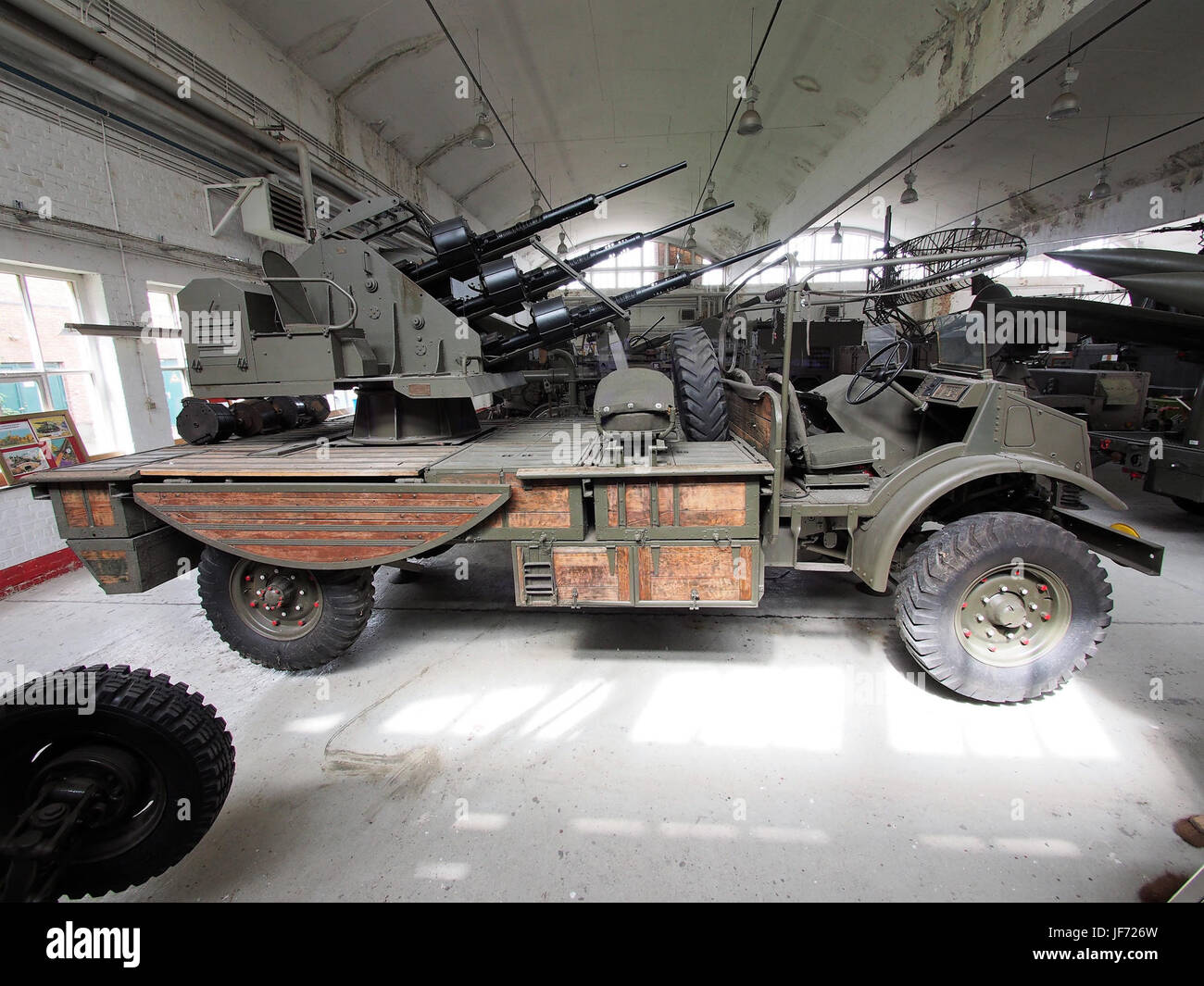 A Chevrolet CMP truck equipped with a triple-mounted anti-aircraft ...