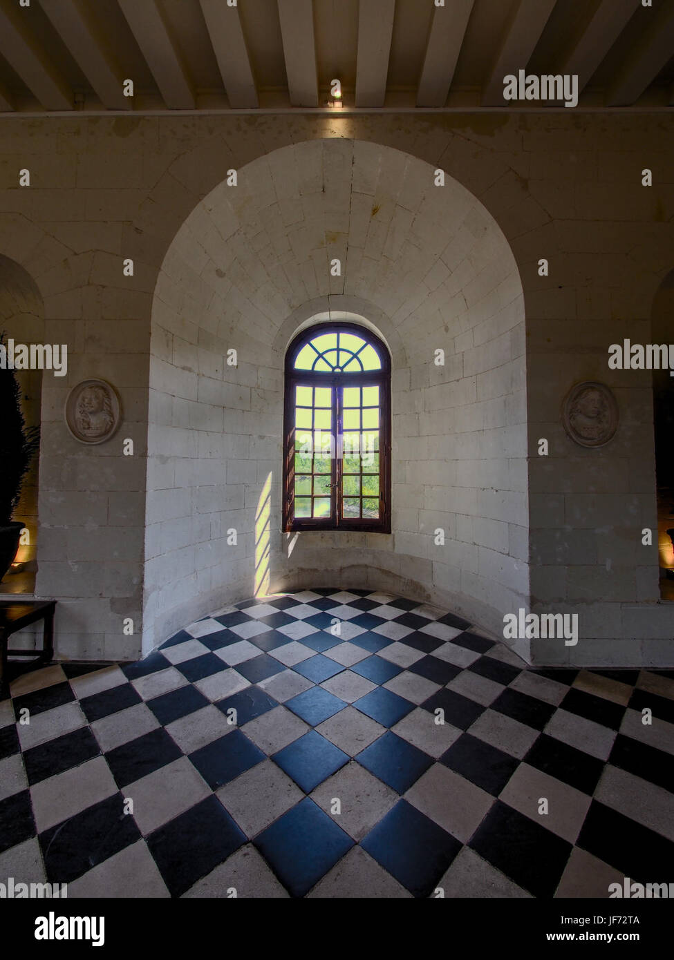 A window in the alcove of Château de Chenonceau, one of the most famous ...