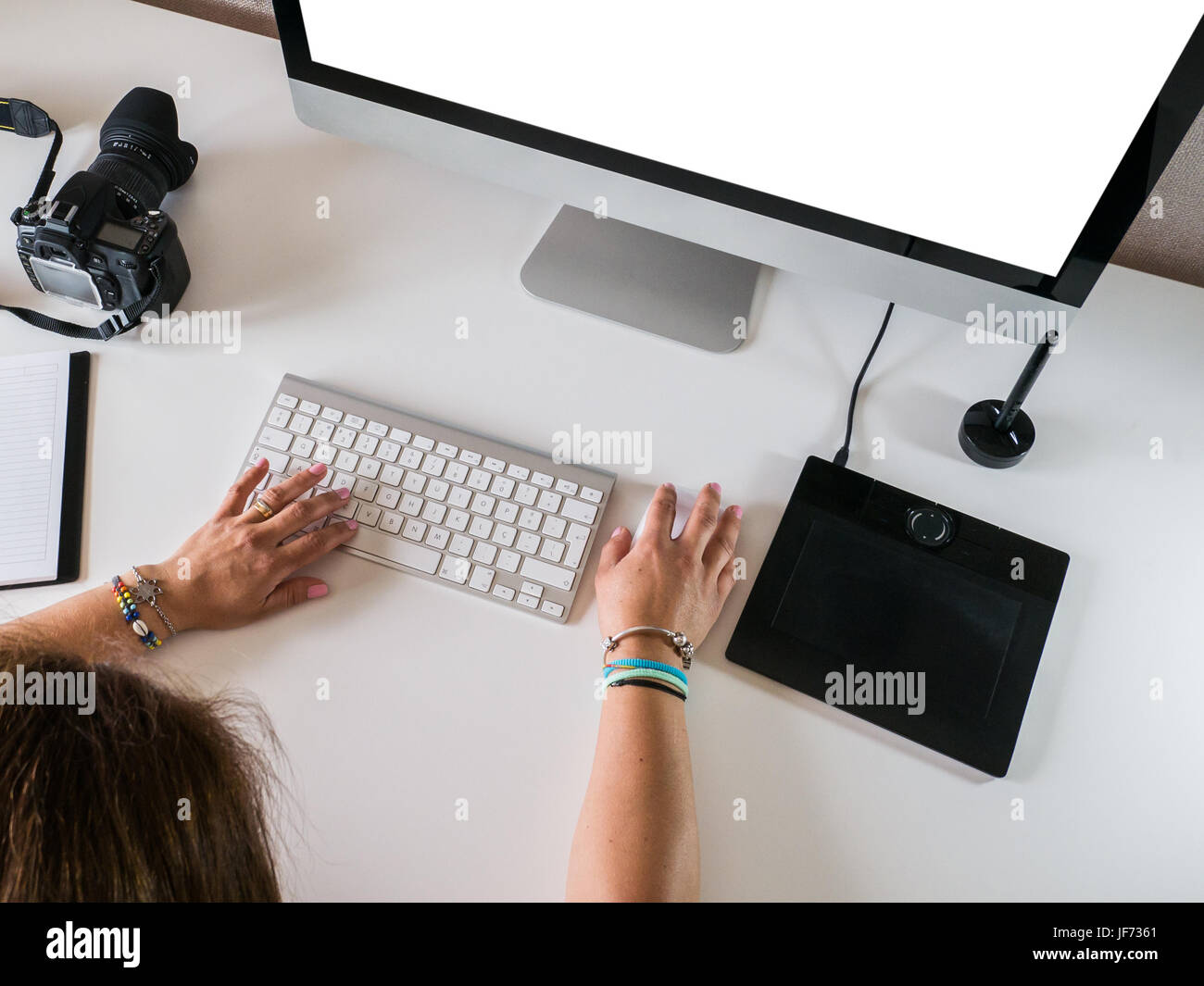 Woman working a video editing project on a modern computer setup Stock ...