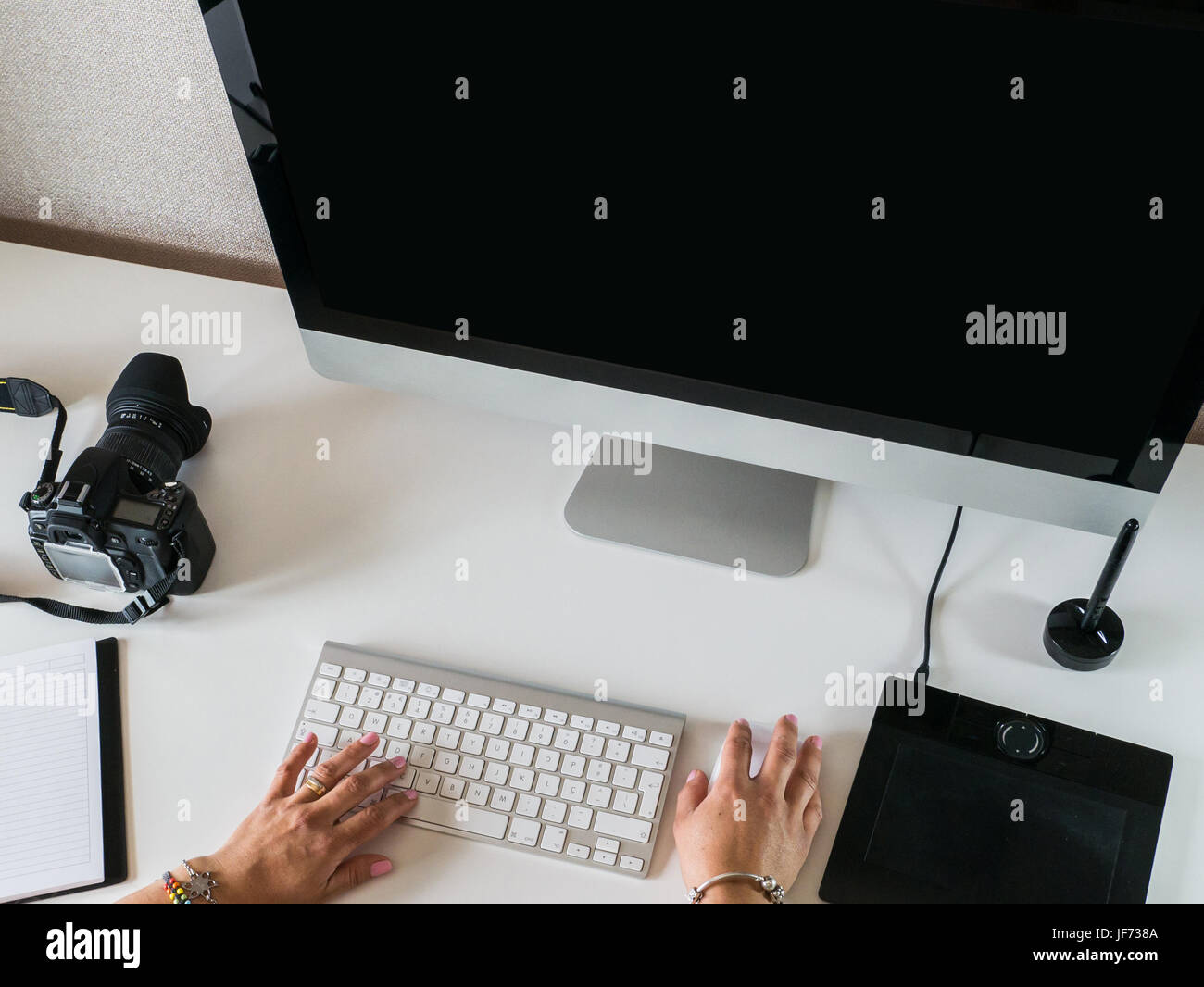 Woman working a video editing project on a modern computer setup Stock ...
