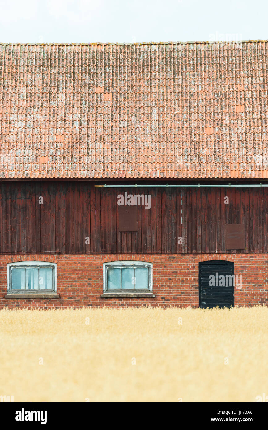 Farm house in field Stock Photo - Alamy