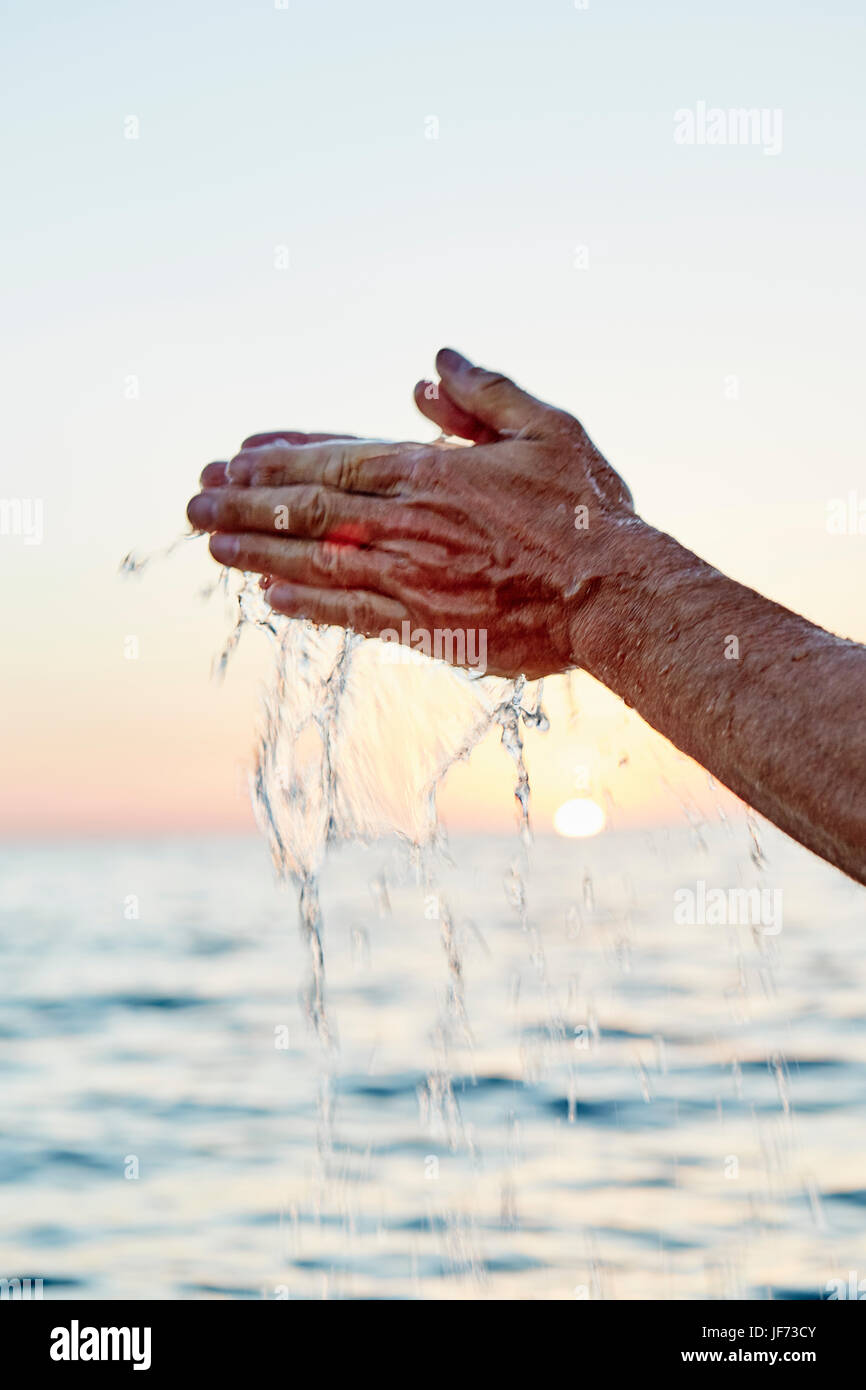 Hand touching surface water hi-res stock photography and images - Alamy