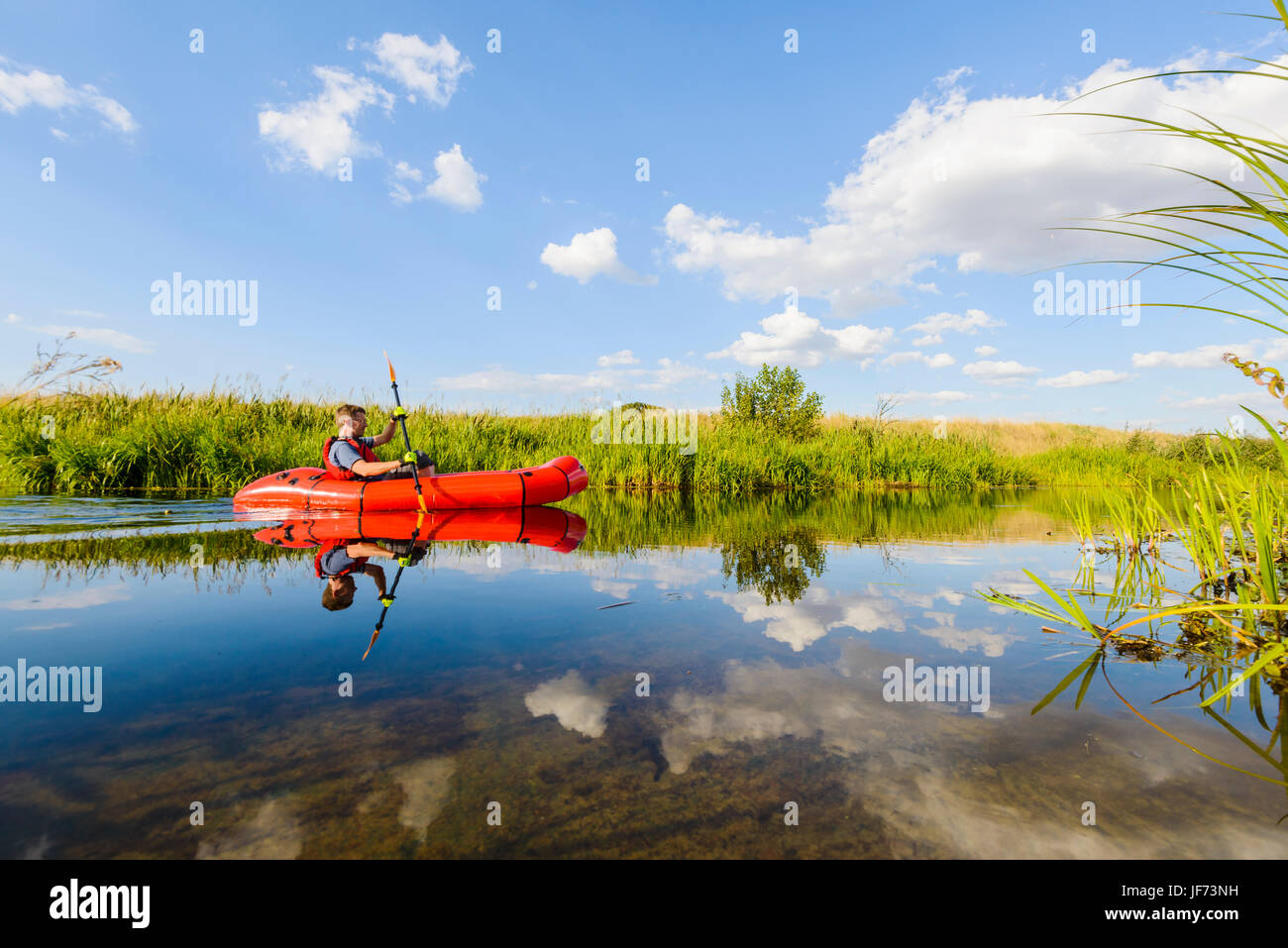 Man rafting on river Stock Photo - Alamy