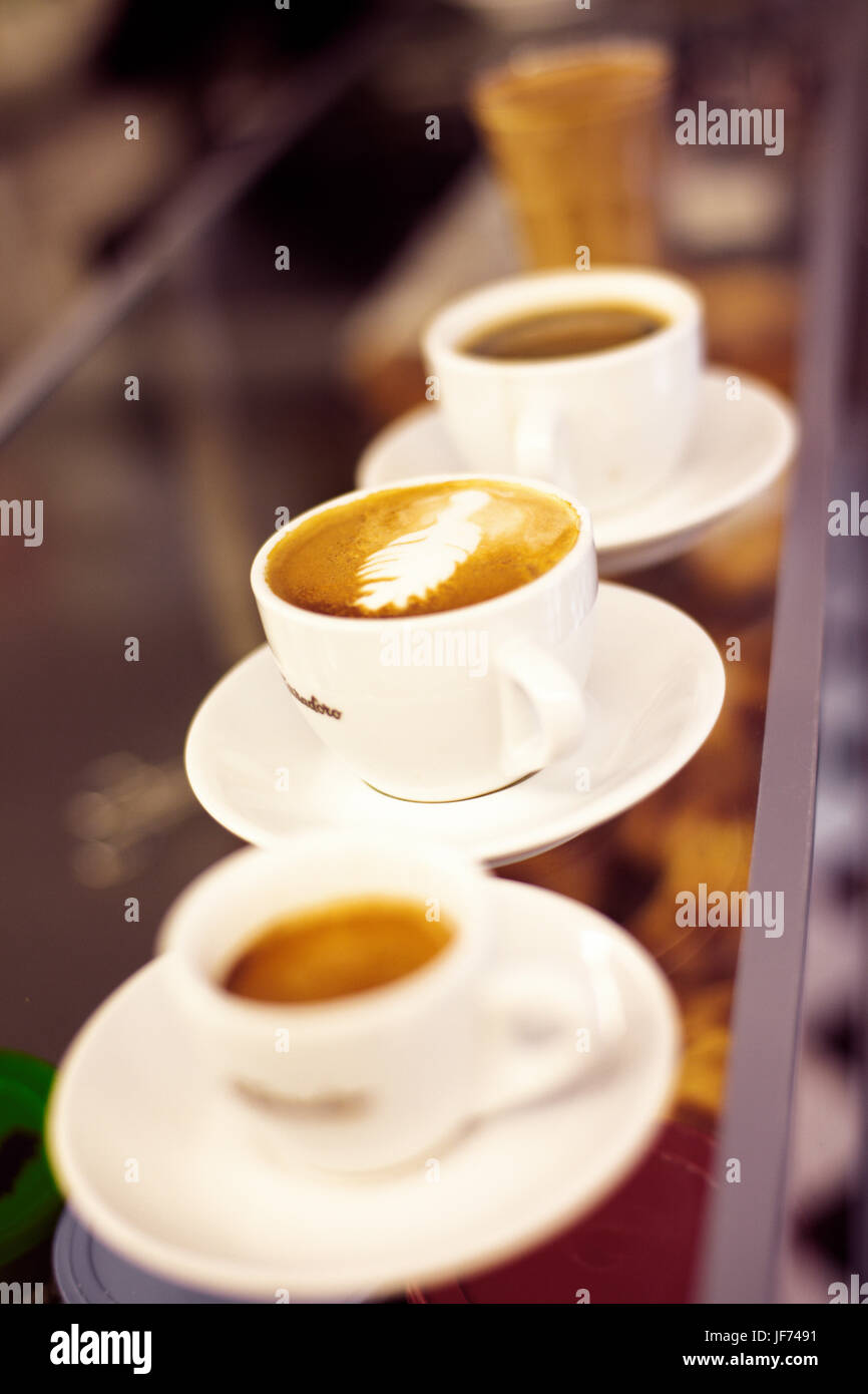 Coffee cups on bar counter Stock Photo - Alamy