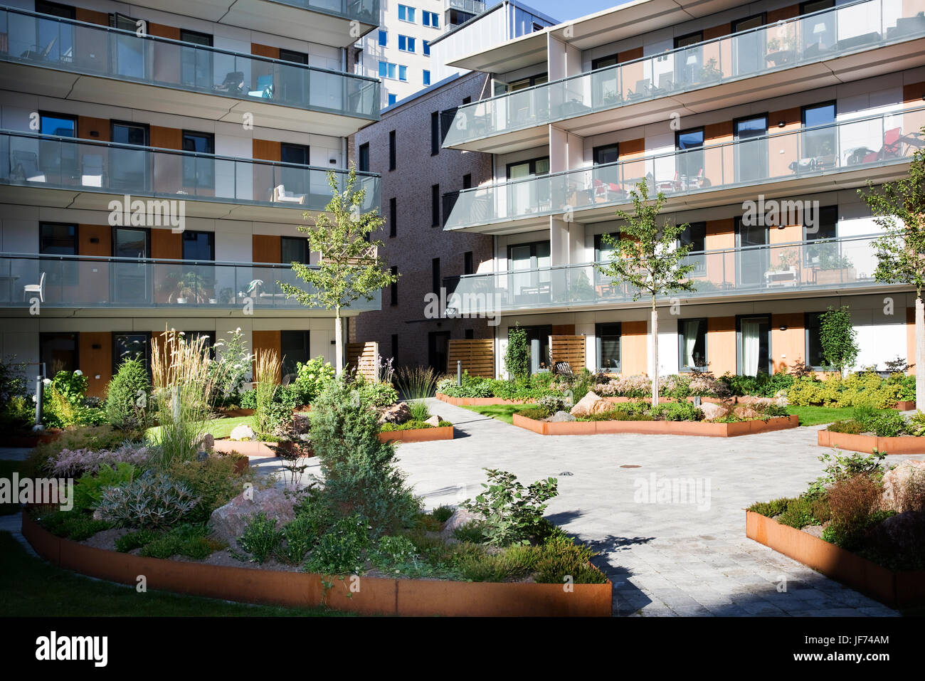 Garden in front of apartment buildings Stock Photo - Alamy