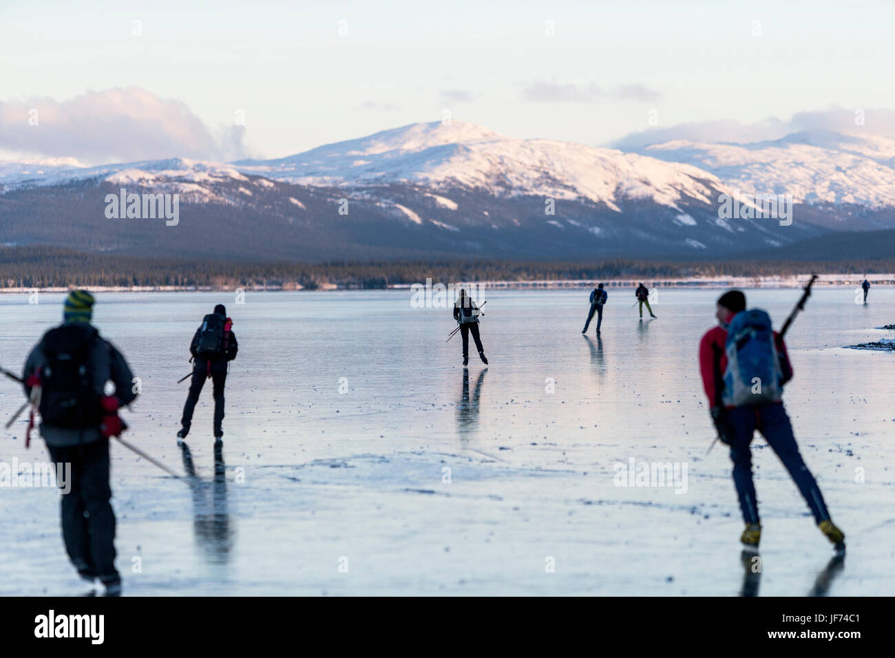 People moving on ice Stock Photo - Alamy