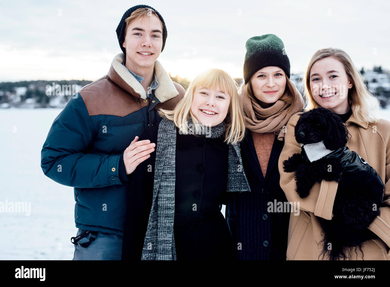 A group of friends and a dog Stock Photo - Alamy