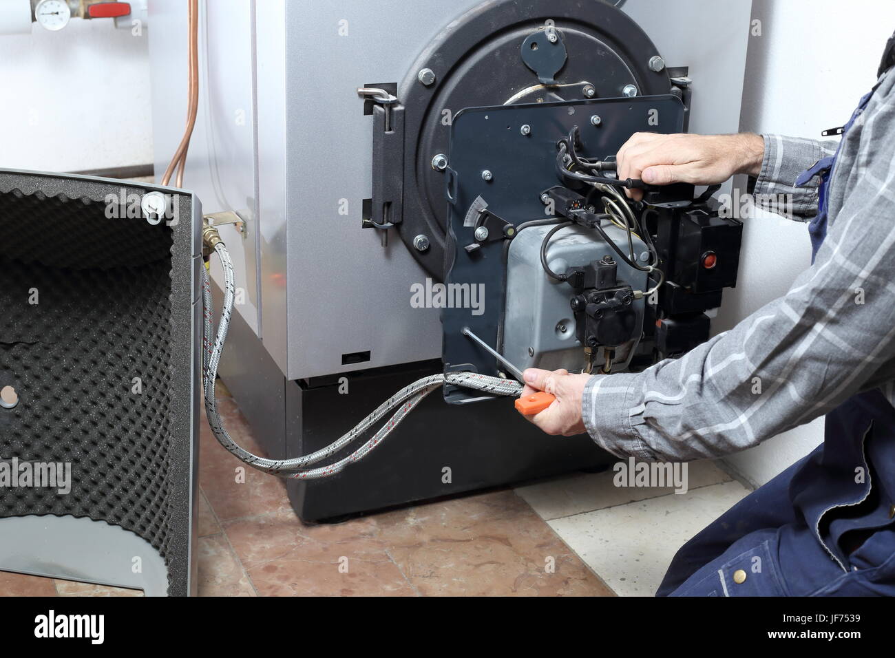 Checking the burner hi-res stock photography and images - Alamy