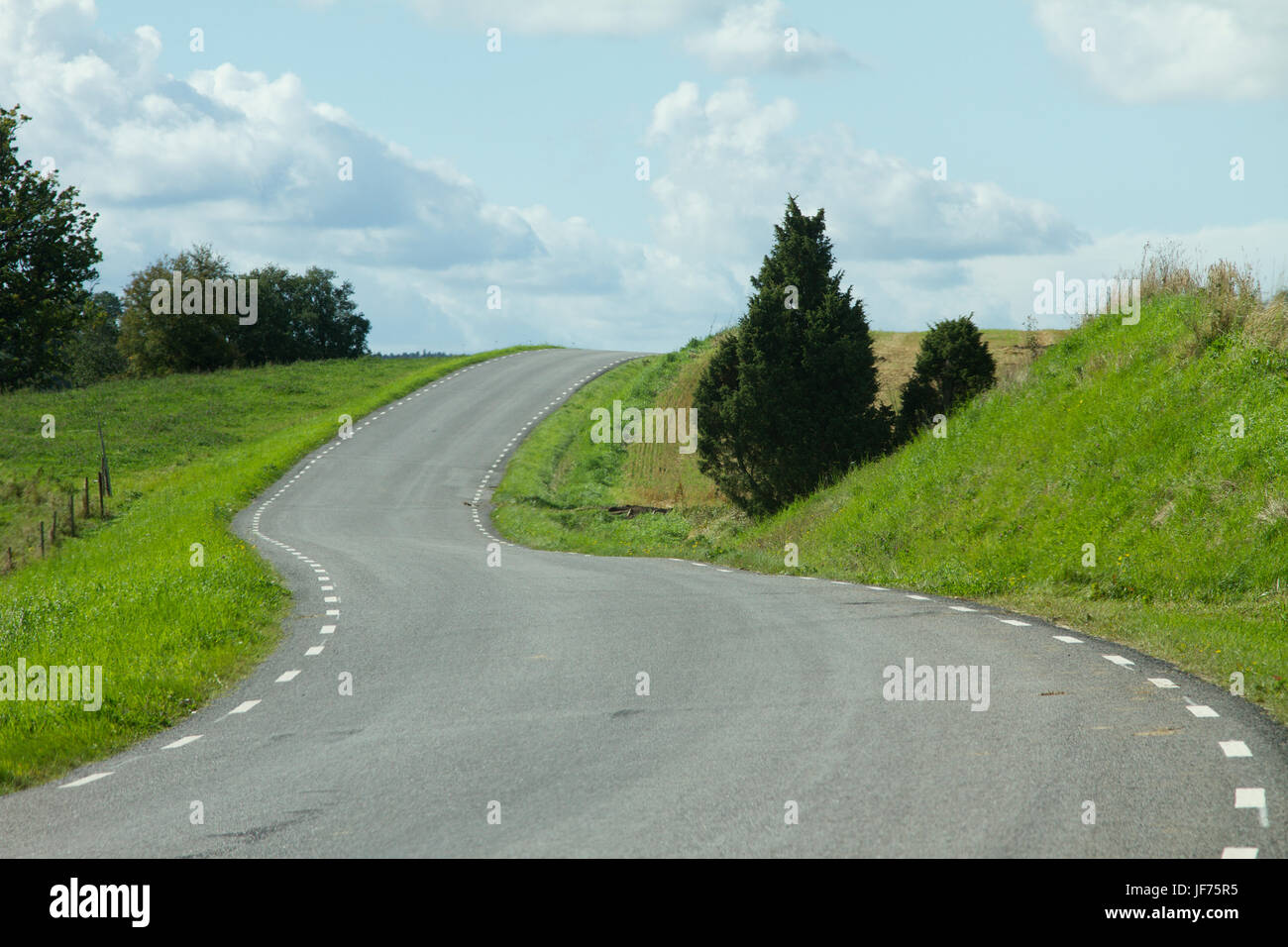 Road in rural landscape Stock Photo - Alamy