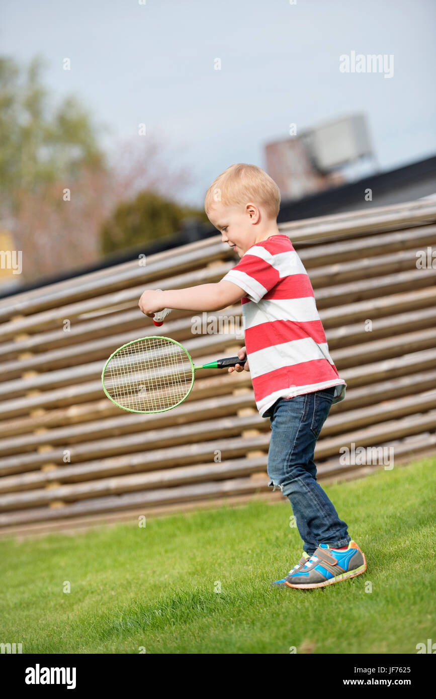 Boy playing badminton Stock Photo - Alamy