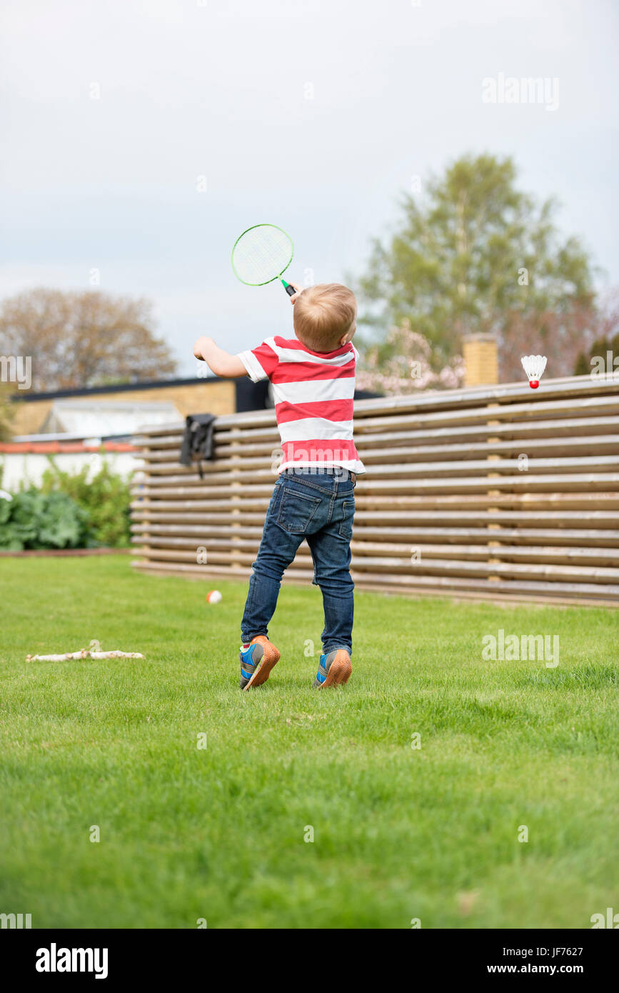 Boy playing badminton Stock Photo - Alamy