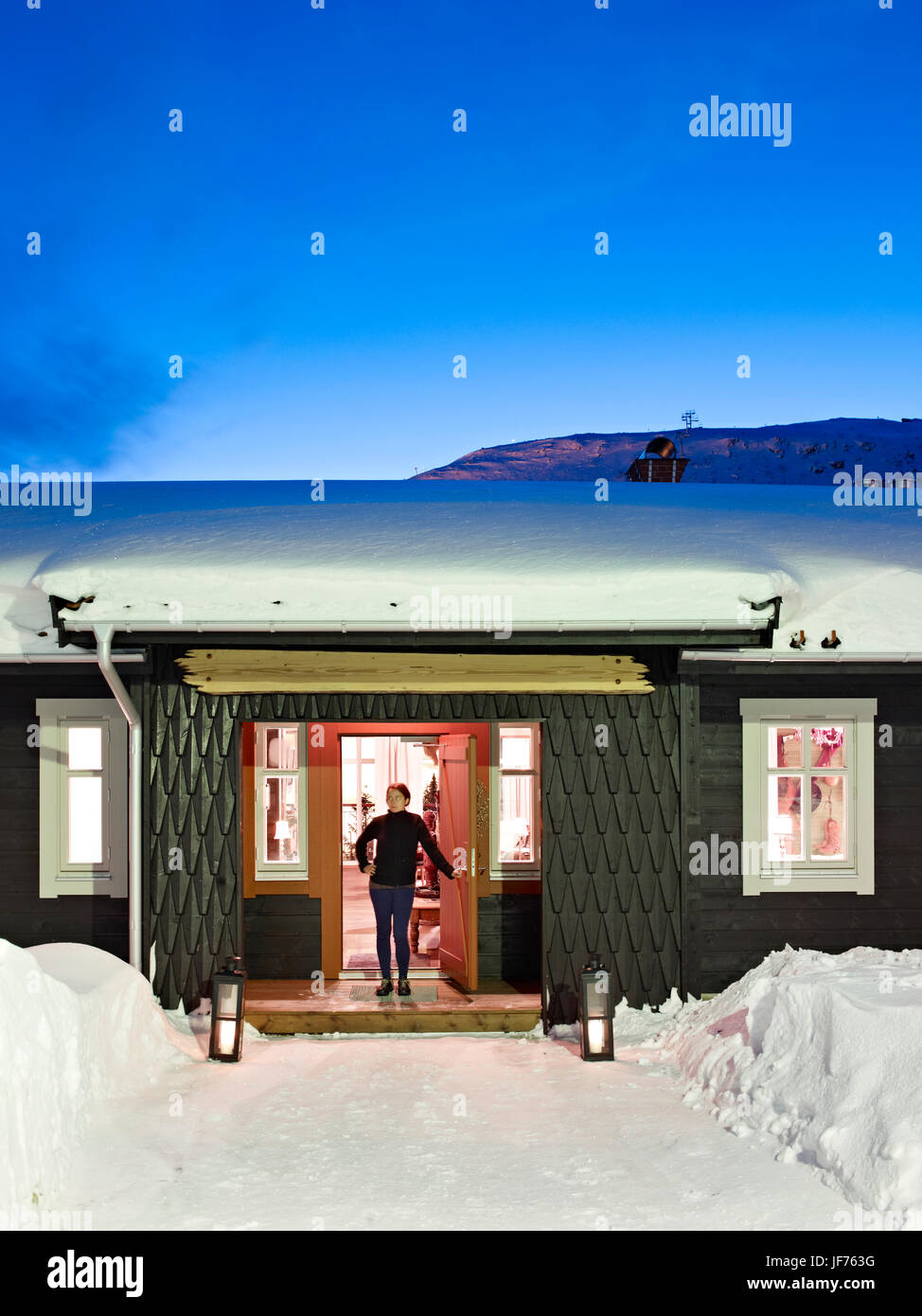 Woman in ski cabin Stock Photo - Alamy