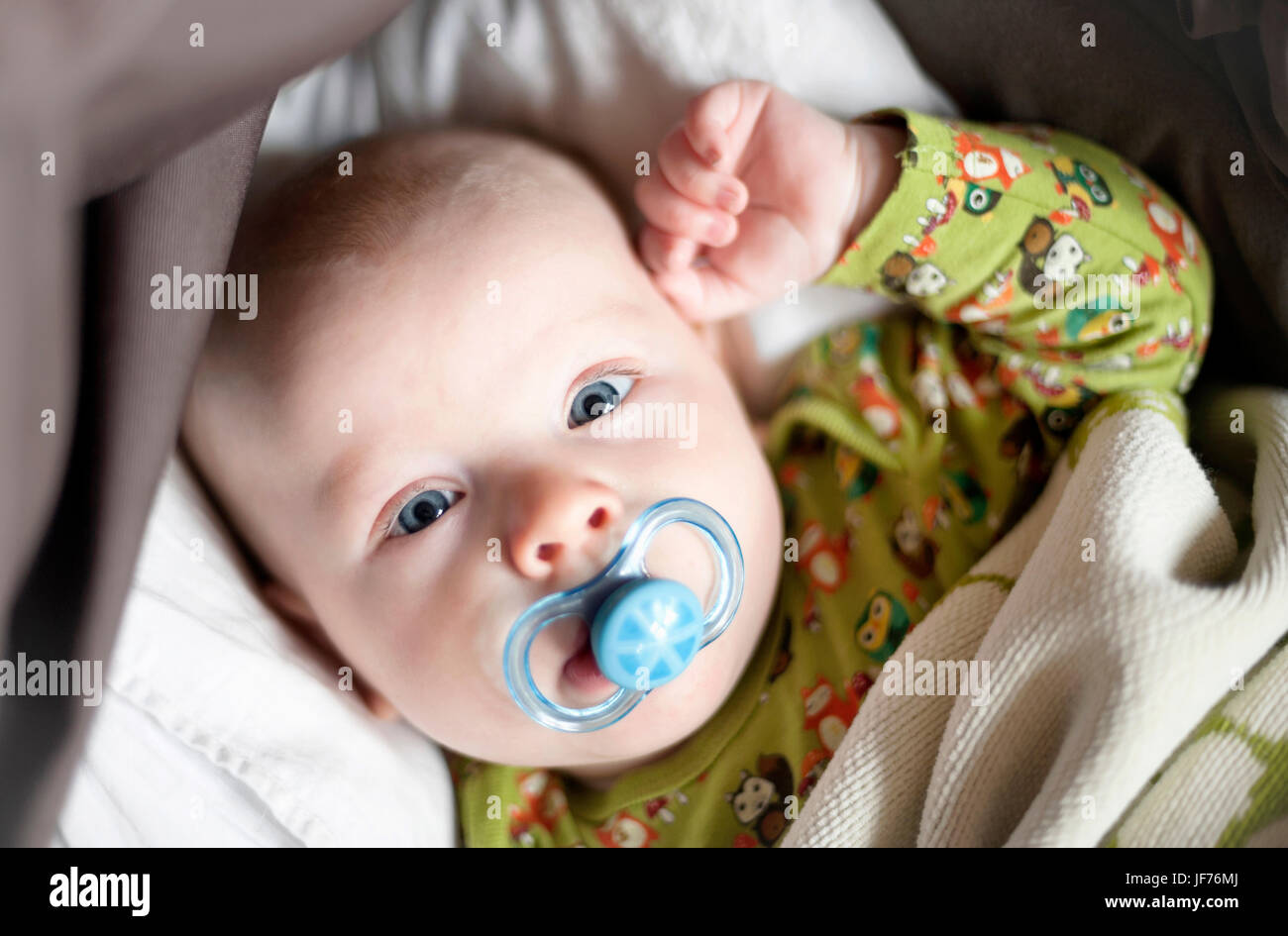 Baby boy with pacifier Stock Photo - Alamy