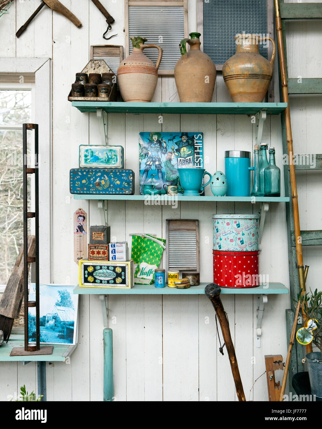 Containers and vases on wooden shelves Stock Photo - Alamy
