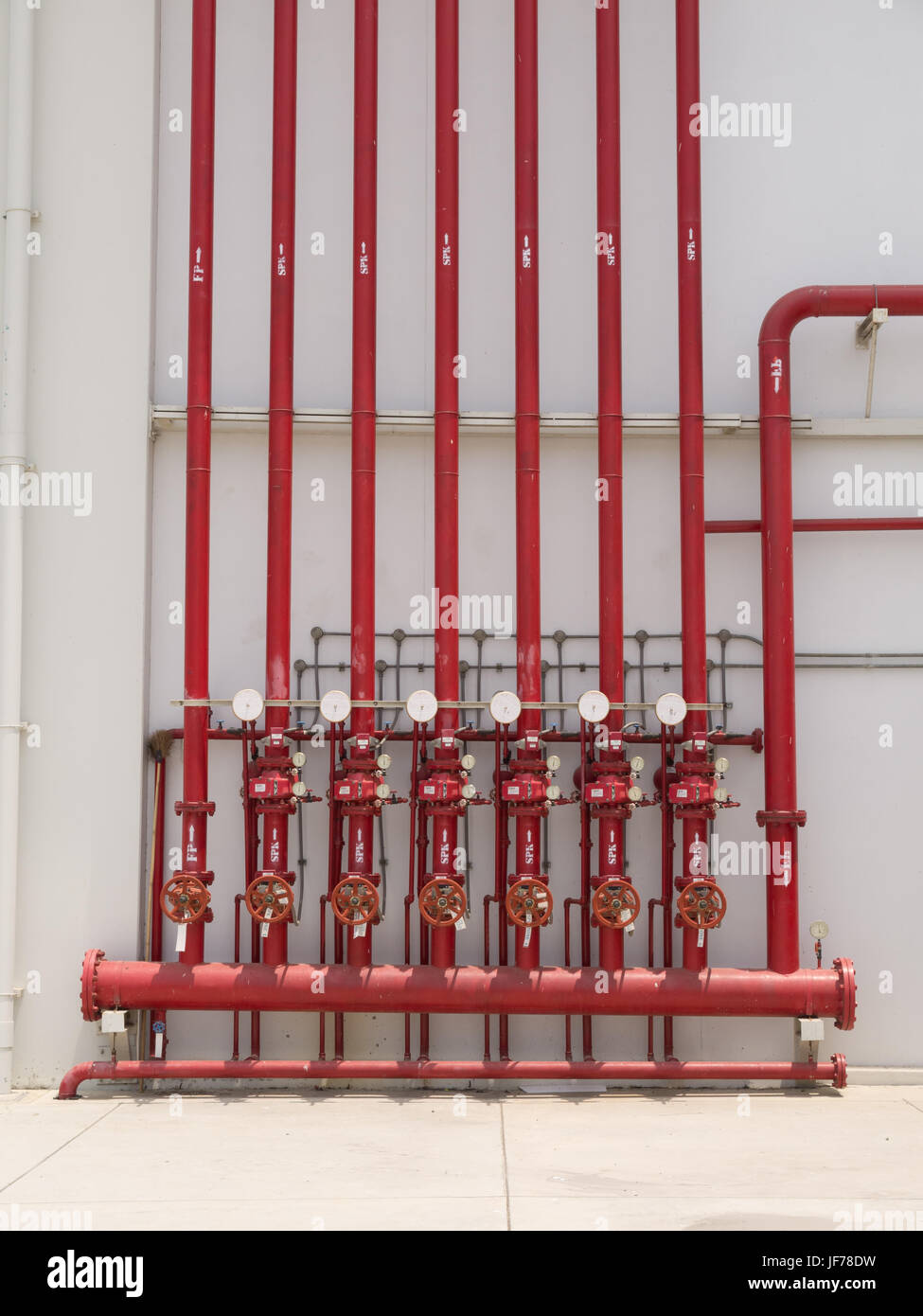 A row of red color fire fighting water supply pipeline system Stock ...