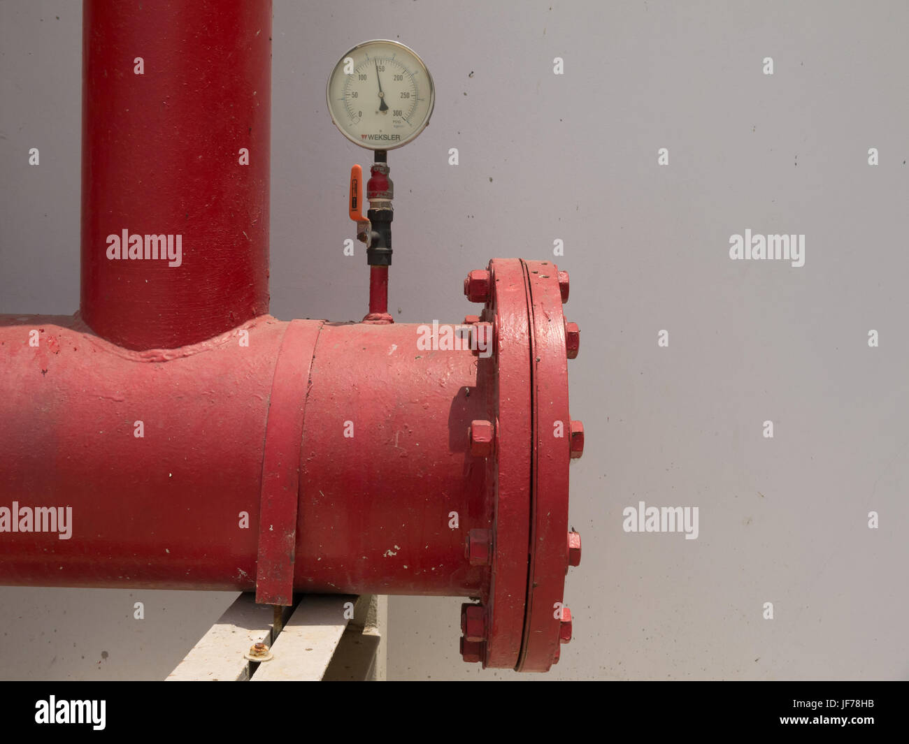 A row of red color fire fighting water supply pipeline system Stock ...