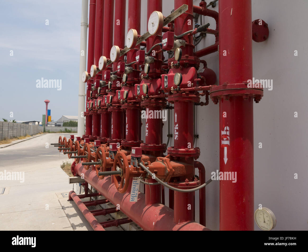 A row of red color fire fighting water supply pipeline system Stock ...