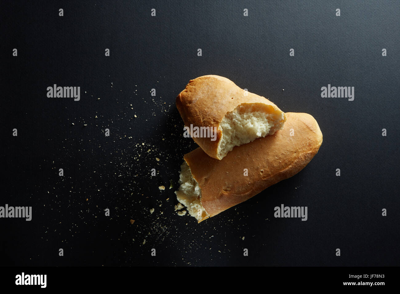 Broken wheat loaf hi-res stock photography and images - Alamy