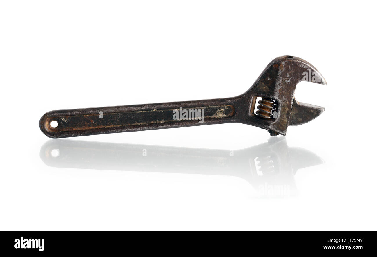 Old rusty adjustable wrench on white background. Clipping path is ...