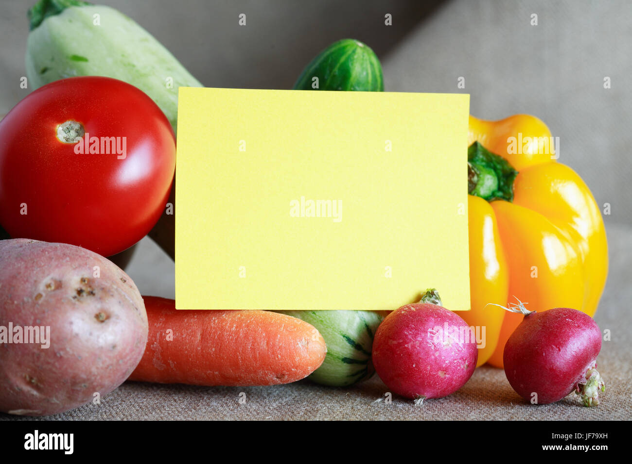Various vegetables with blank yellow paper for recipe or menu Stock ...