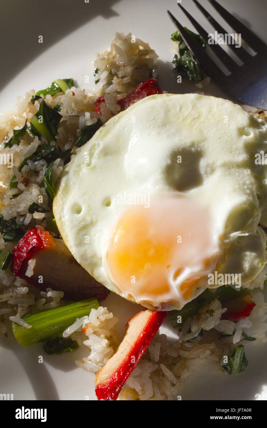 Fried rice with a fried egg on top Stock Photo - Alamy
