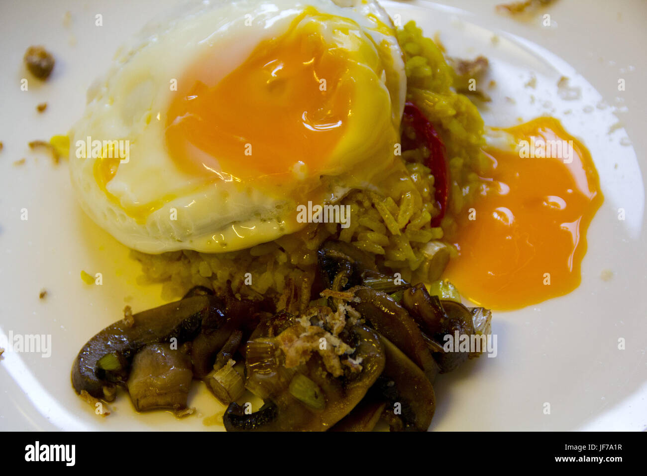 Nasi kuning, Indonesian yellow rice with a fried egg topping popular in ...