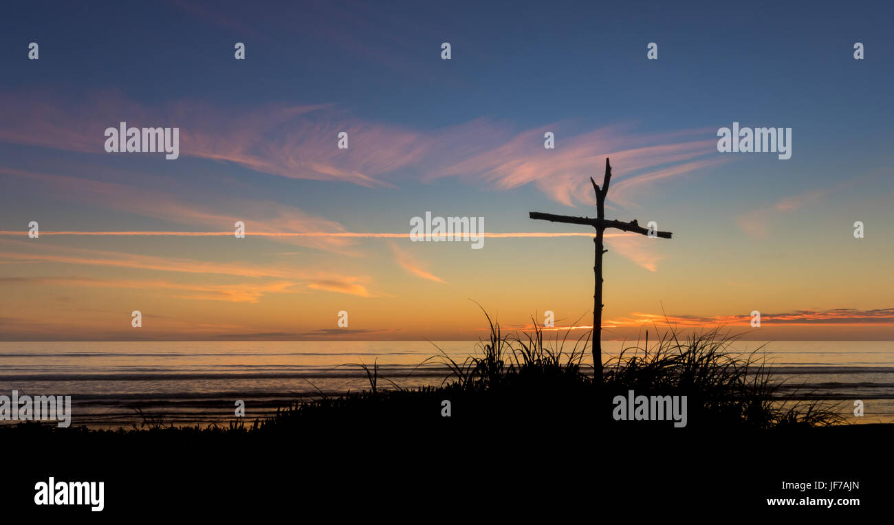 Cross on a sand dune on a beach as the sunsets Stock Photo - Alamy