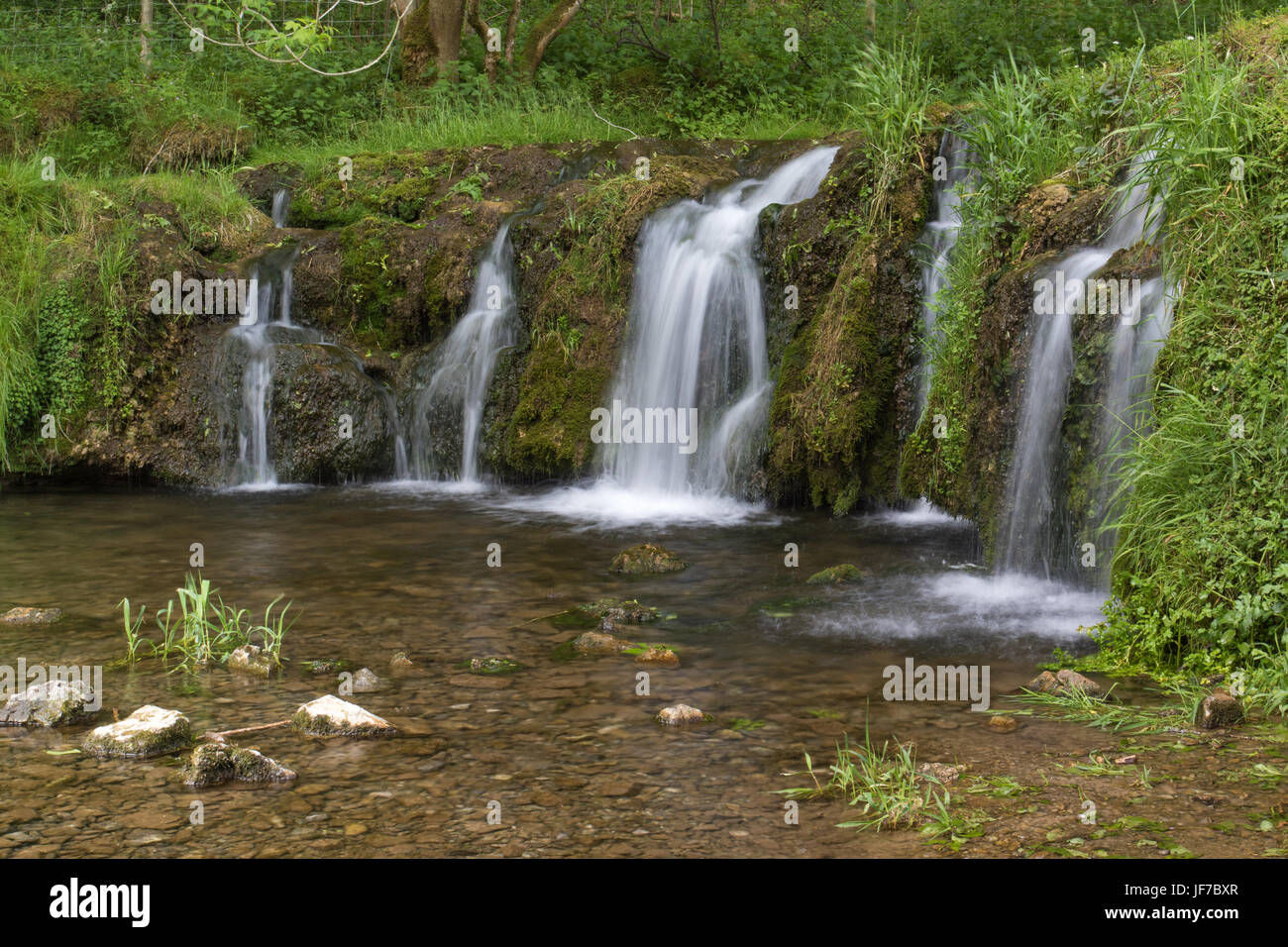 waterfall on the River Lathkill in Lathkill Dale, Peak District ...