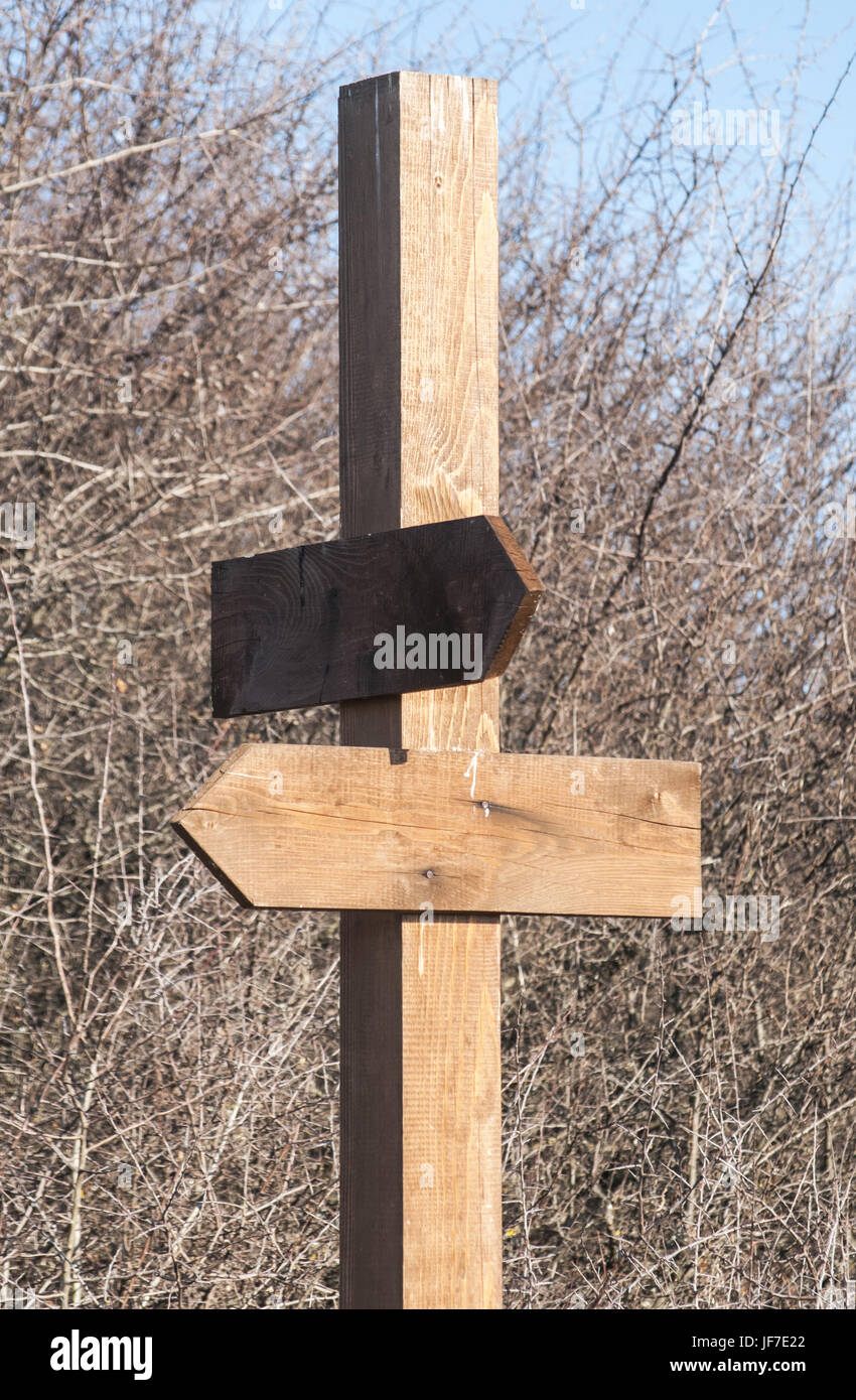 Wooden signboard with arrows Stock Photo - Alamy