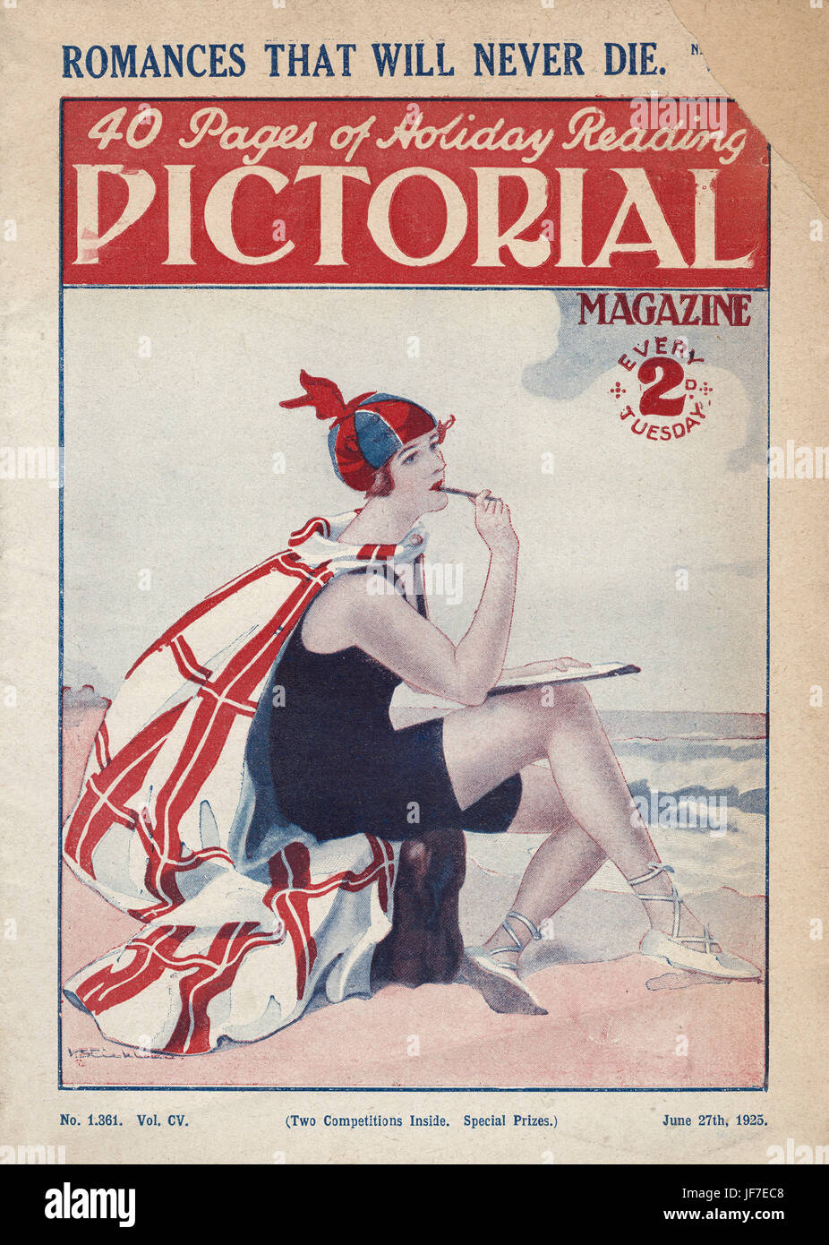 1920s woman sitting on beach by the sea in bathing costume and cape and ...