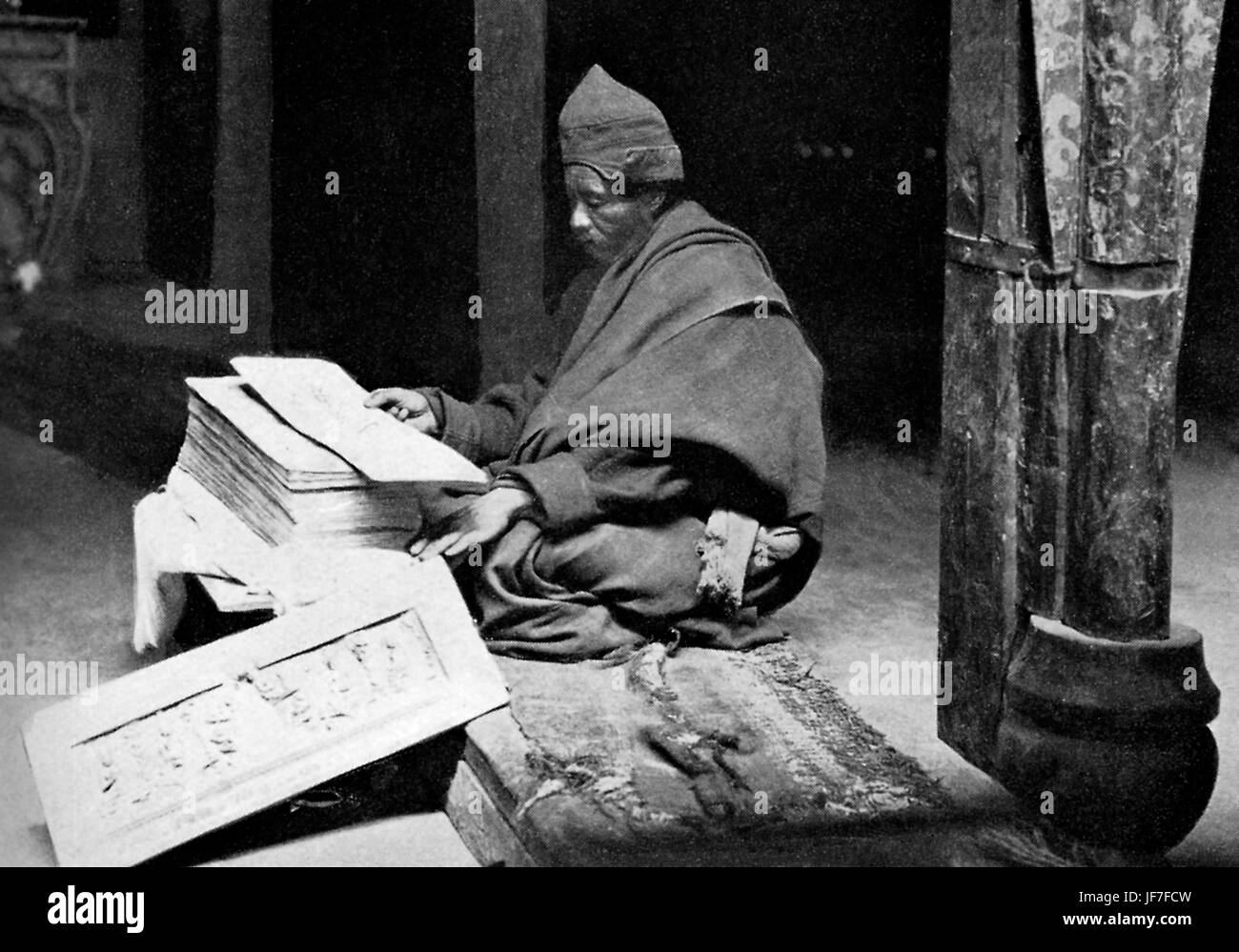 Tibetan monk reading book Black and White Stock Photos & Images - Alamy