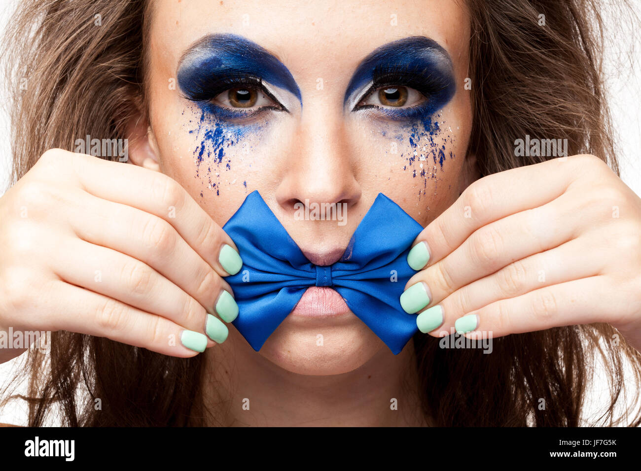 Girl holding a bow in mouth Stock Photo - Alamy