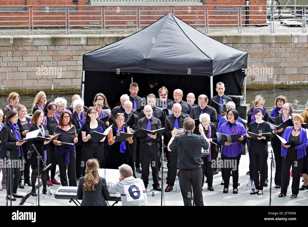 Choir singing at an outdoor event in Liverpool UK Stock Photo - Alamy