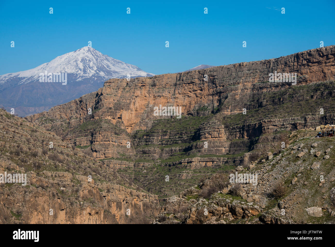 Snow capped mountain looming over a huge canyon on the upper Hamilton ...