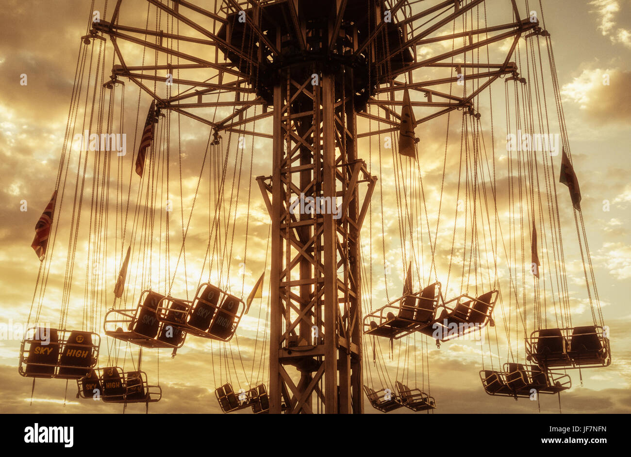 Fairground ride at sunset Stock Photo - Alamy