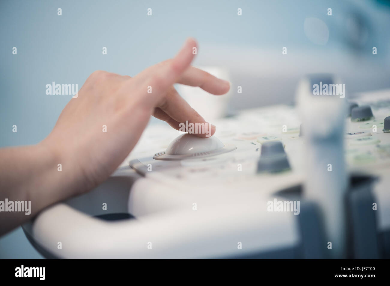 Skillful sonographer using ultrasound machine at work Stock Photo - Alamy