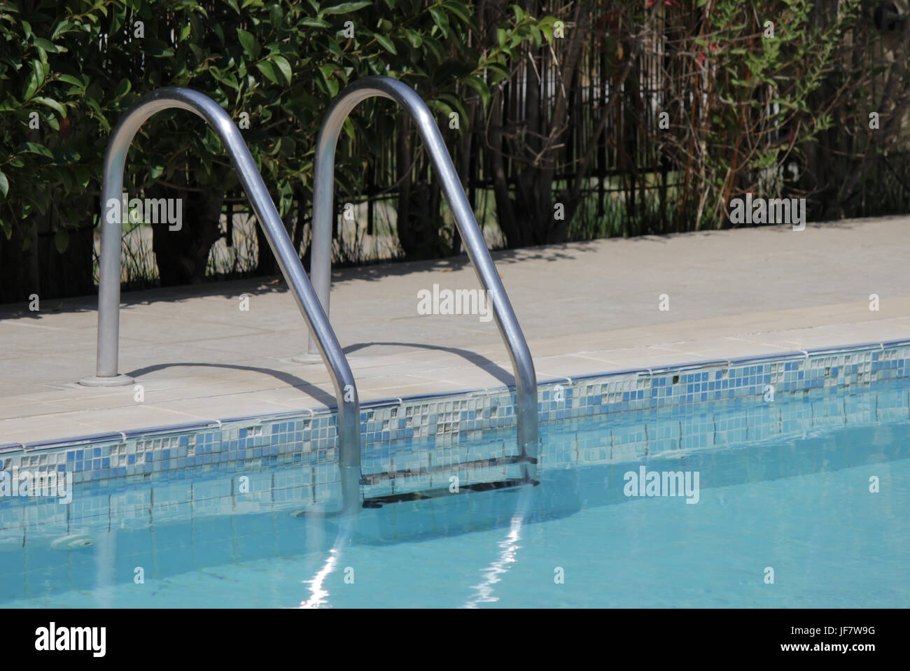 Steps in swimming pool Stock Photo - Alamy