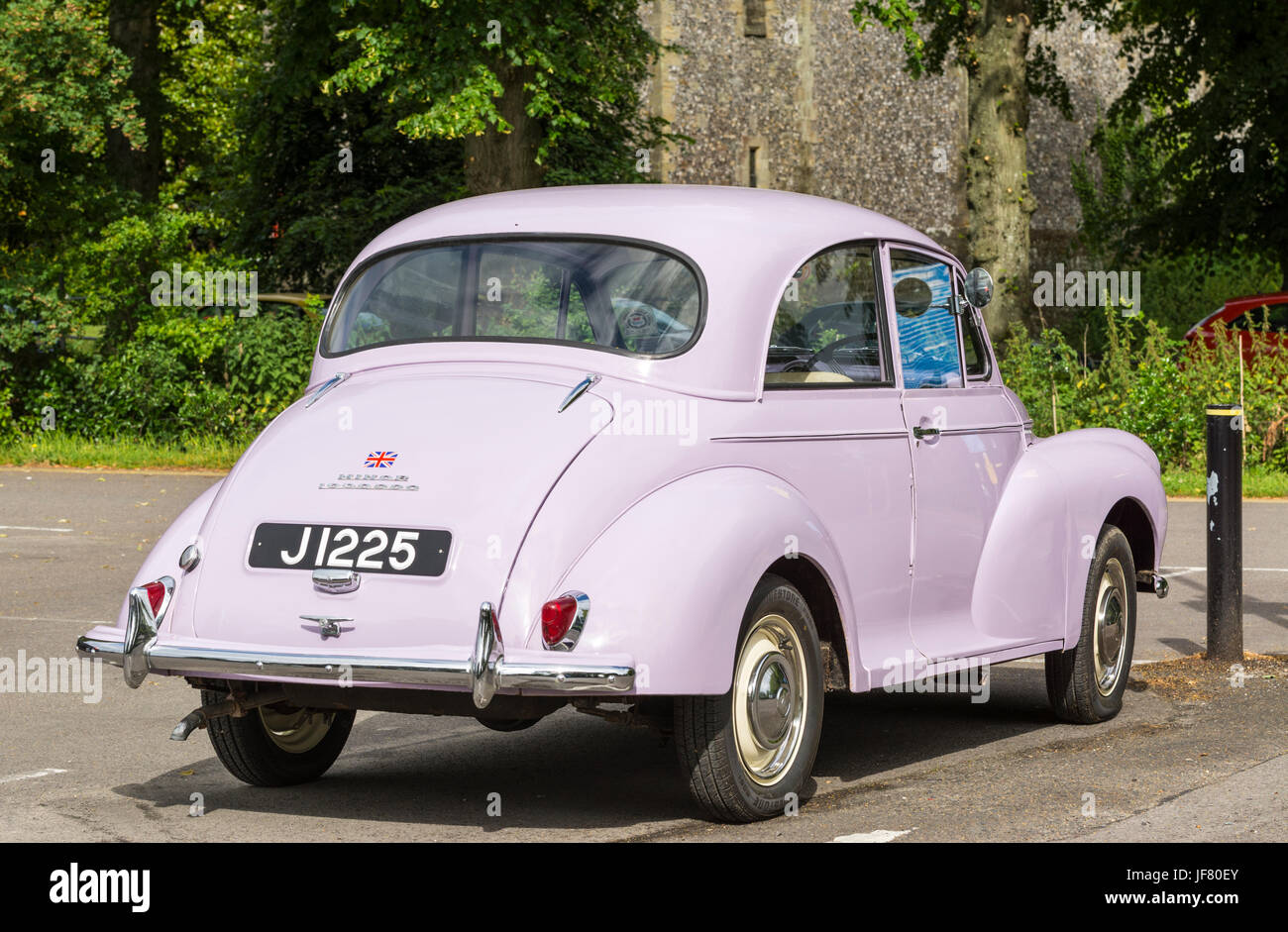 Morris Minor 1000000 car called "Millie" in pink, parked in a car park ...