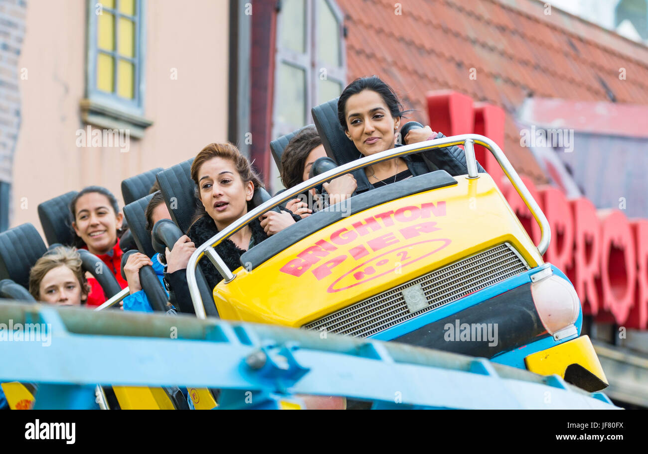 Turbo Coaster. People riding on the Turbo Coaster roller coaster ride ...