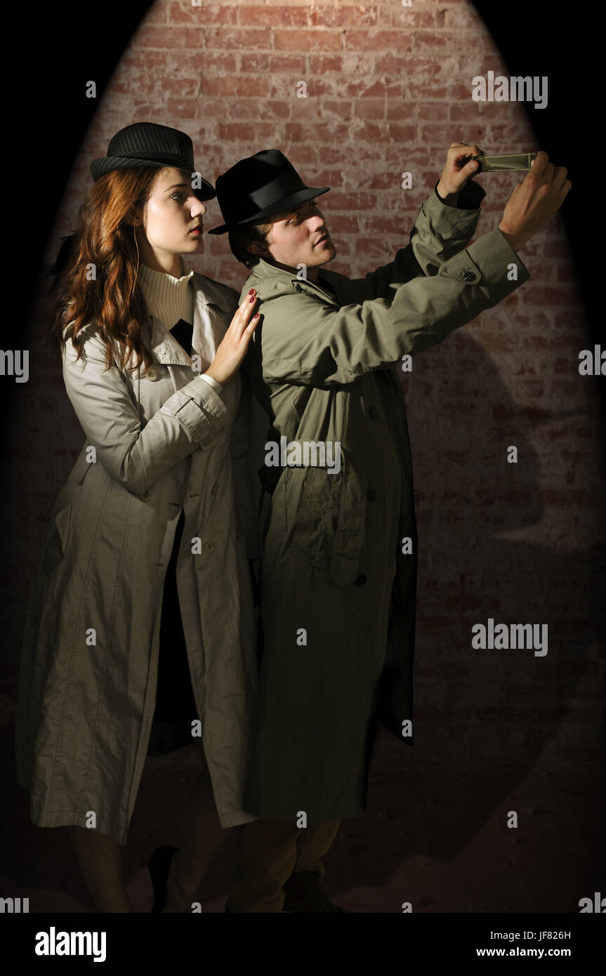Man and woman spies Stock Photo - Alamy