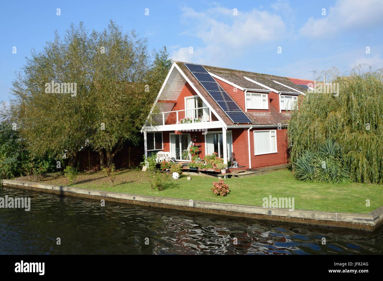 House with river at front Stock Photo - Alamy