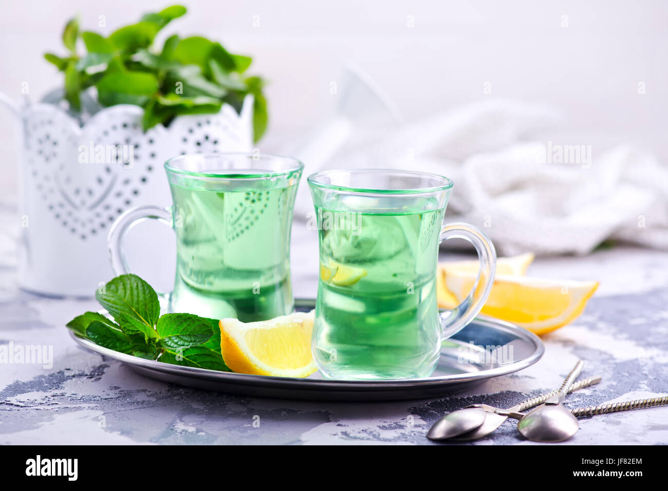 fresh tea in glass cups and on a table Stock Photo - Alamy